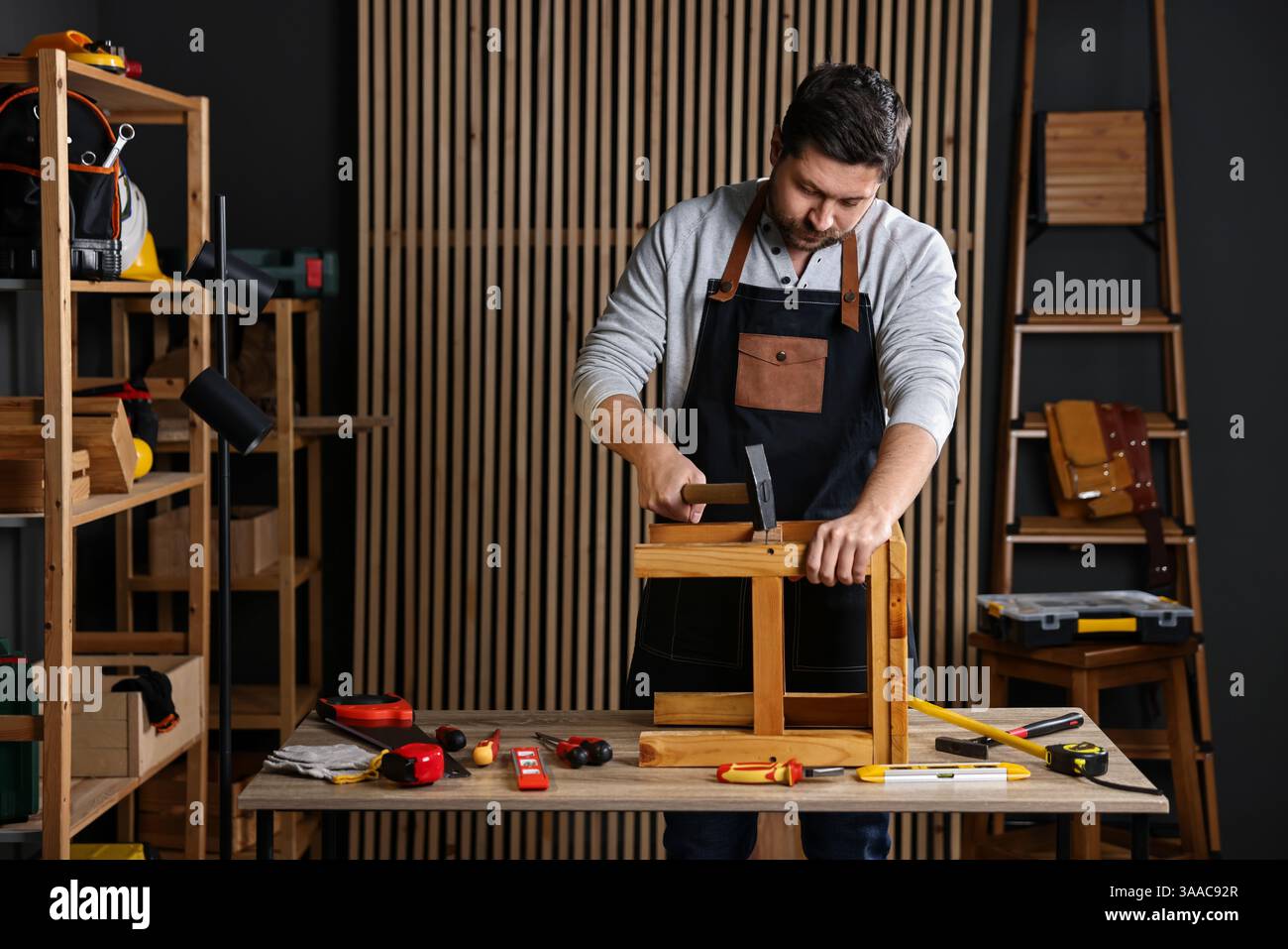 Carpenter repairing stool table hi-res stock photography and images - Alamy