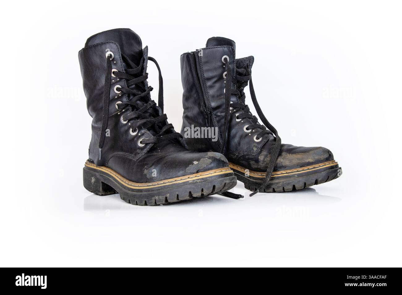 Pair of rugged worn black ankle leather combat boots with thick, sturdy ...