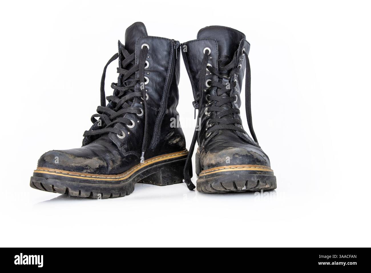 Pair of rugged worn black ankle leather combat boots with thick, sturdy ...