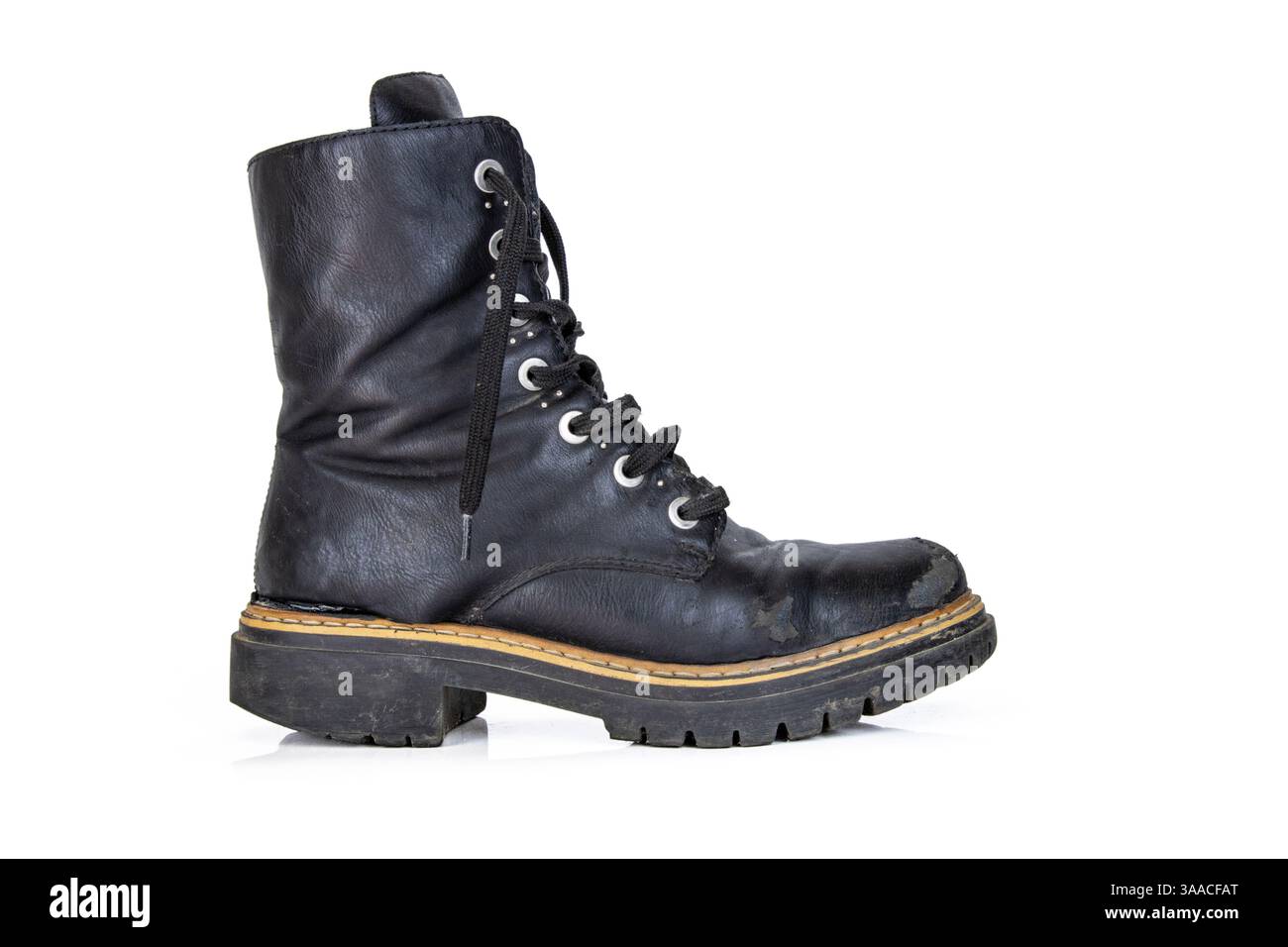 One black worn ankle leather combat boot with thick, sturdy sole and ...
