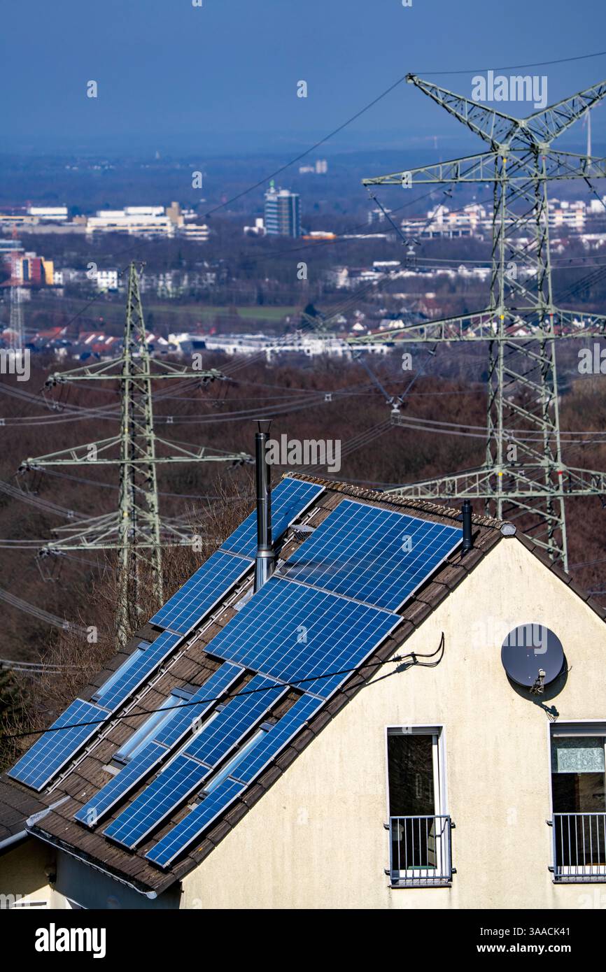 Residential house with photovoltaic system on the roof, power lines ...