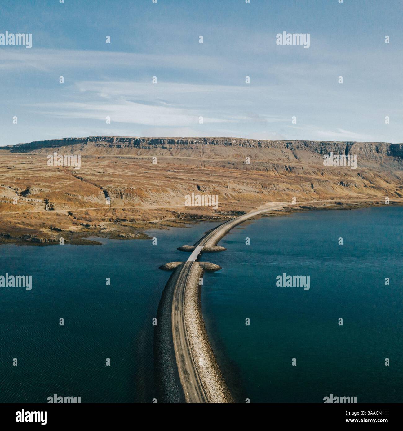Aerial view of road crossing fjord in Westfjords, Iceland's remote ...