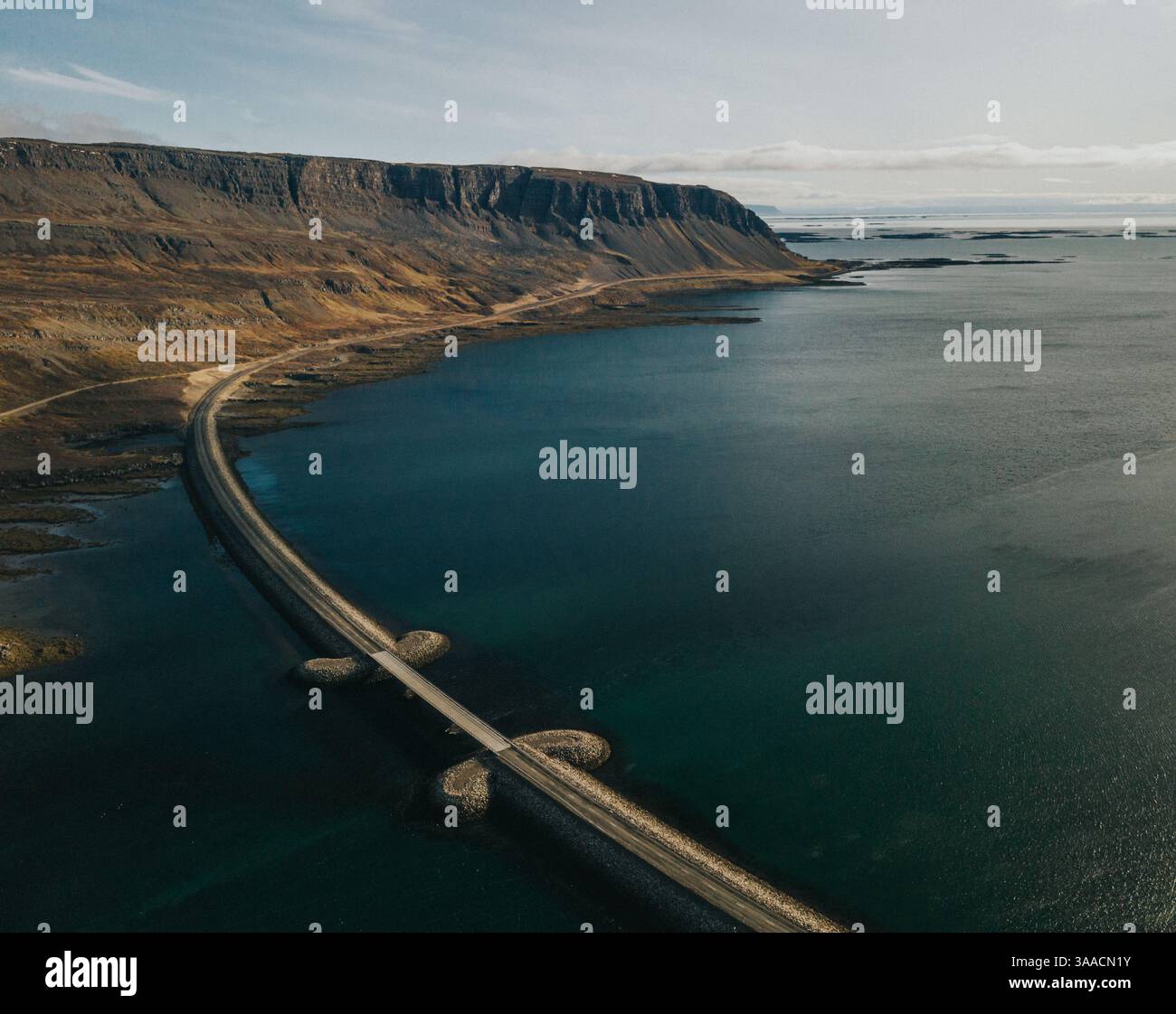 Aerial view of road crossing fjord in Westfjords, Iceland's remote ...