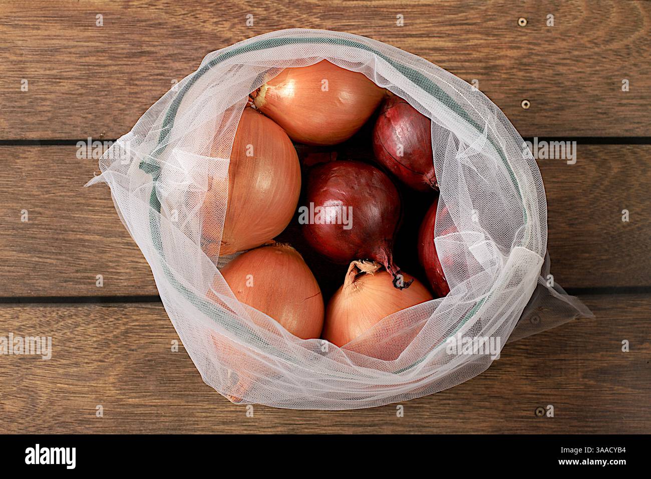 Various varieties of onions in fabric packaging. Healthy natural ...