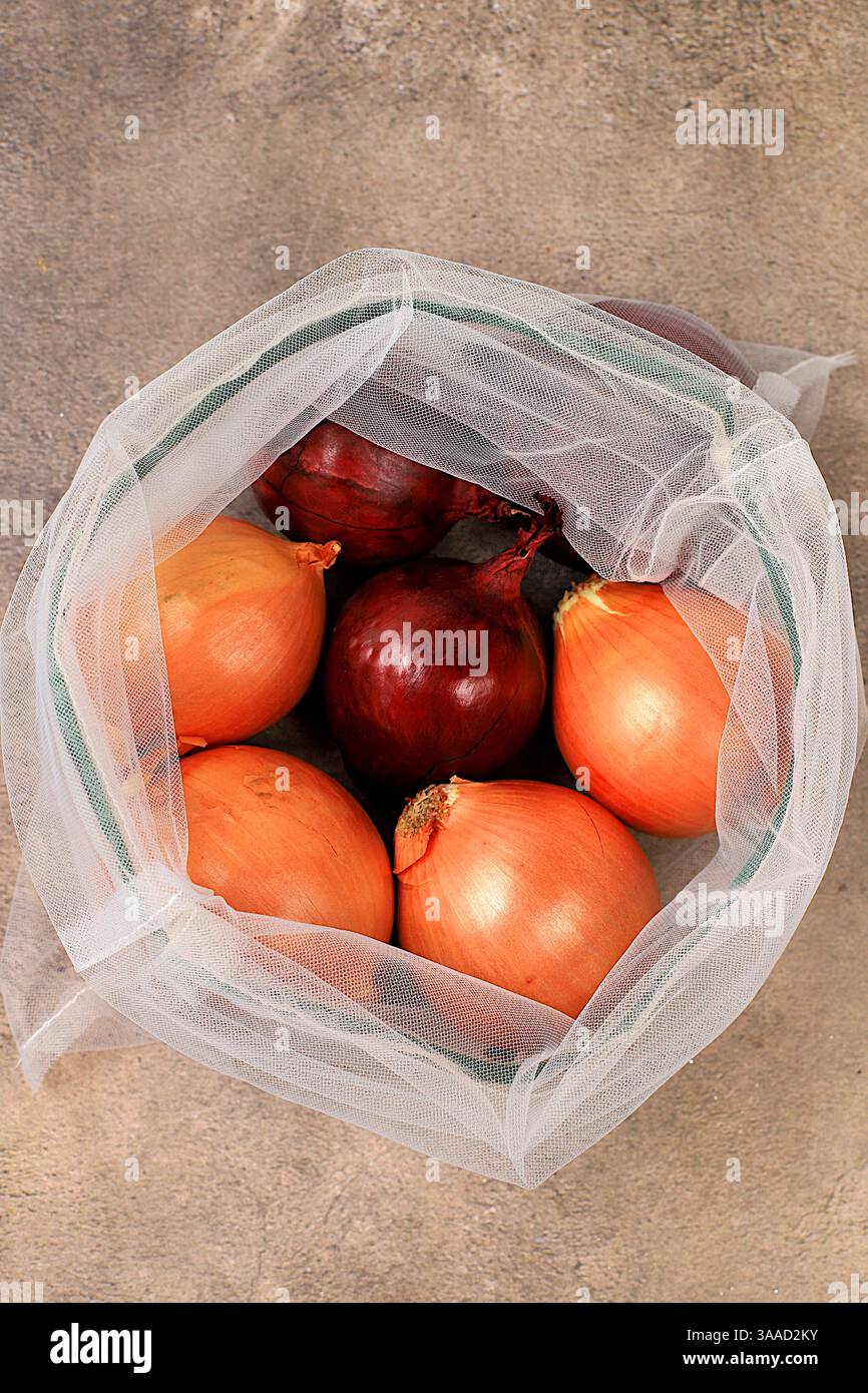 Various varieties of onions in fabric packaging. Healthy natural ...