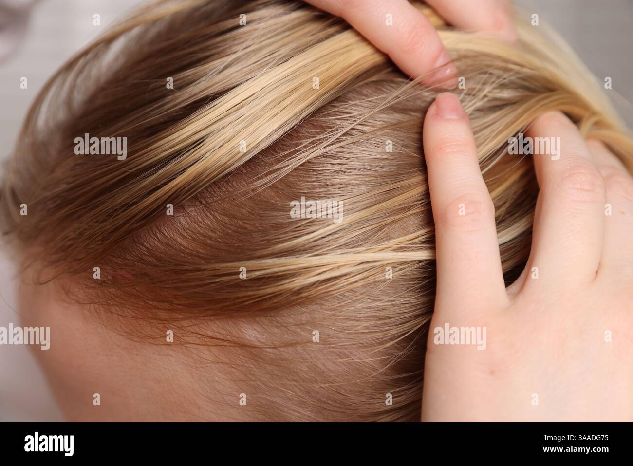 Woman with undying hair roots on blurred background, closeup Stock ...