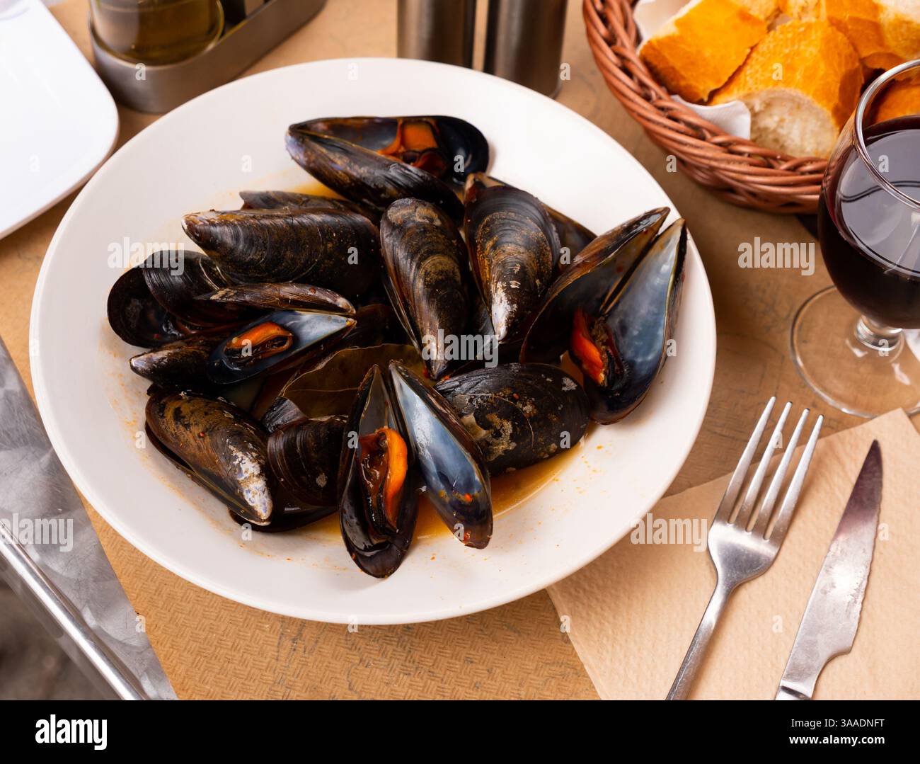 In restaurant of Italian cuisine,sea mussels in tomato and garlic sauce ...