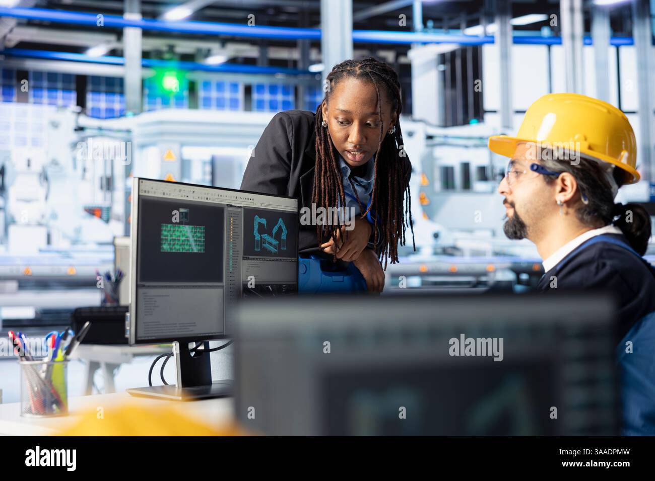 Industrial plant expert overseeing installation hi-res stock ...