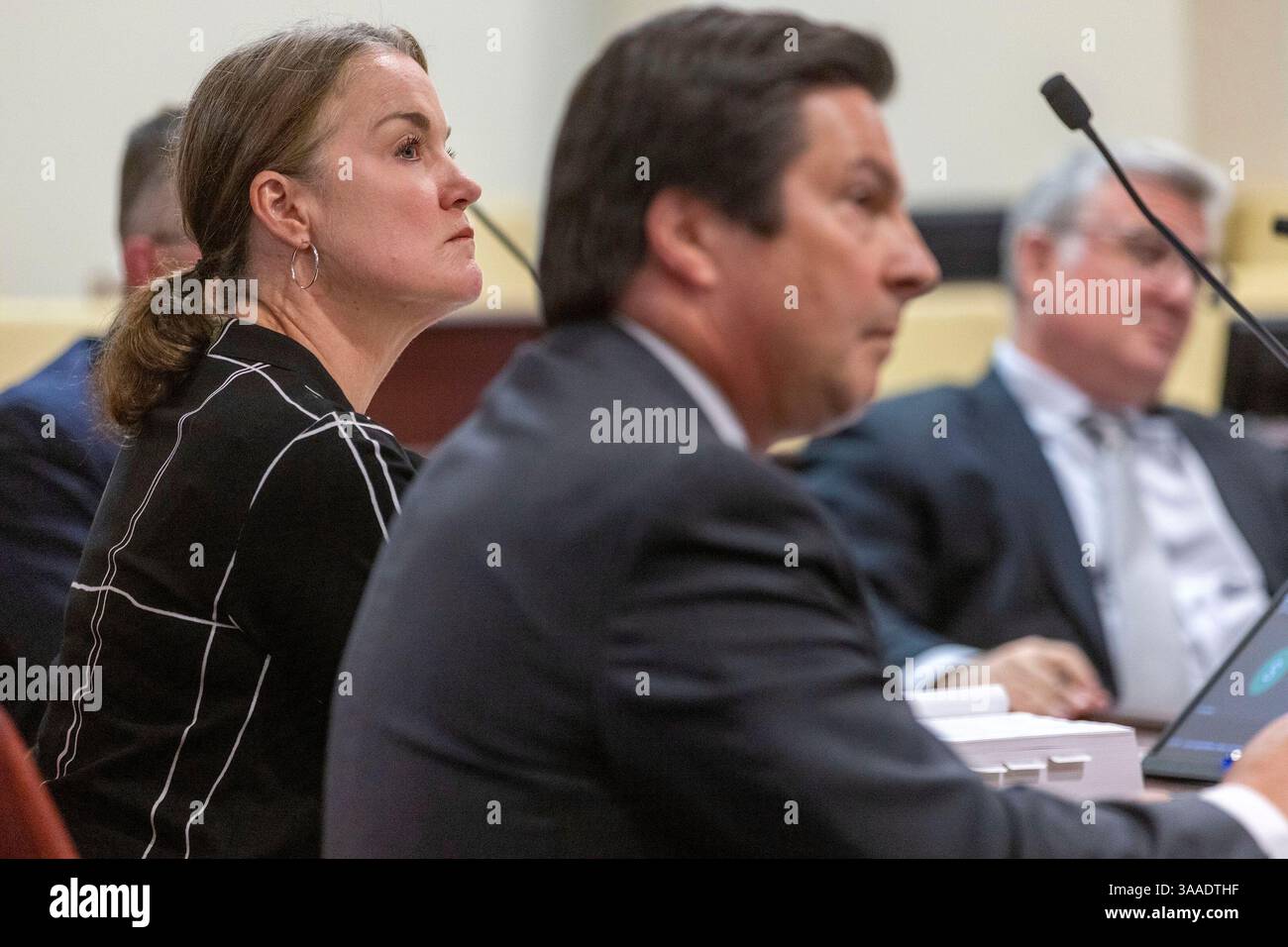 Julia Peters, left, Hackman family estate representative sits with ...