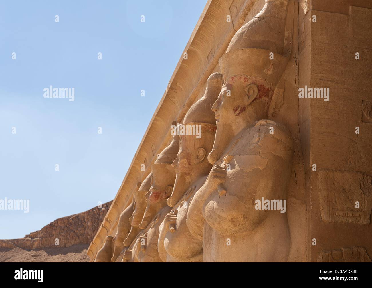 Side view of large statues of pharoahs at Hatshepsut Temple near Luxor ...