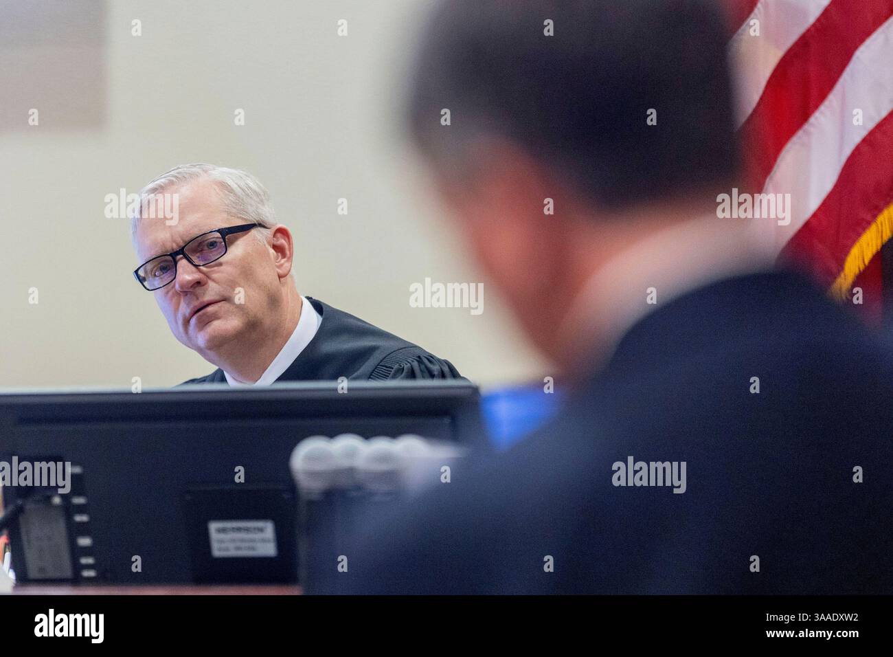 Judge Matthew J. Wilson listens to arguments by attorney Greg Williams ...