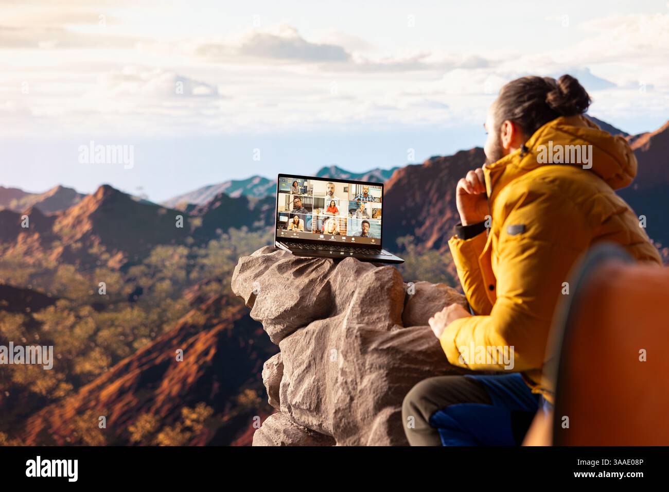 Business employee uses high speed internet connection on mountain top ...