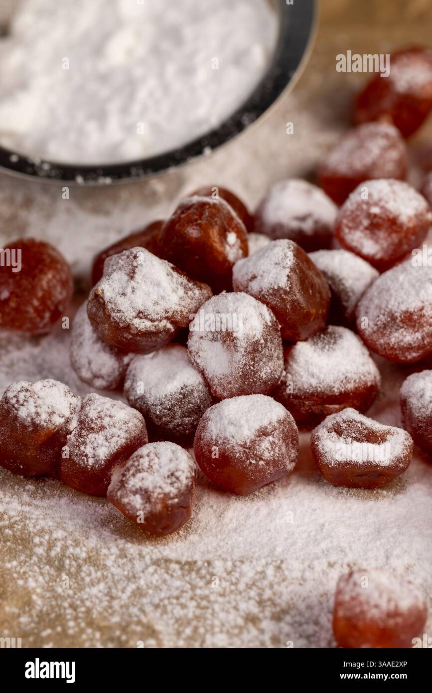 candied kumquat in powdered sugar, sweet dehydrated candied fruits of ...