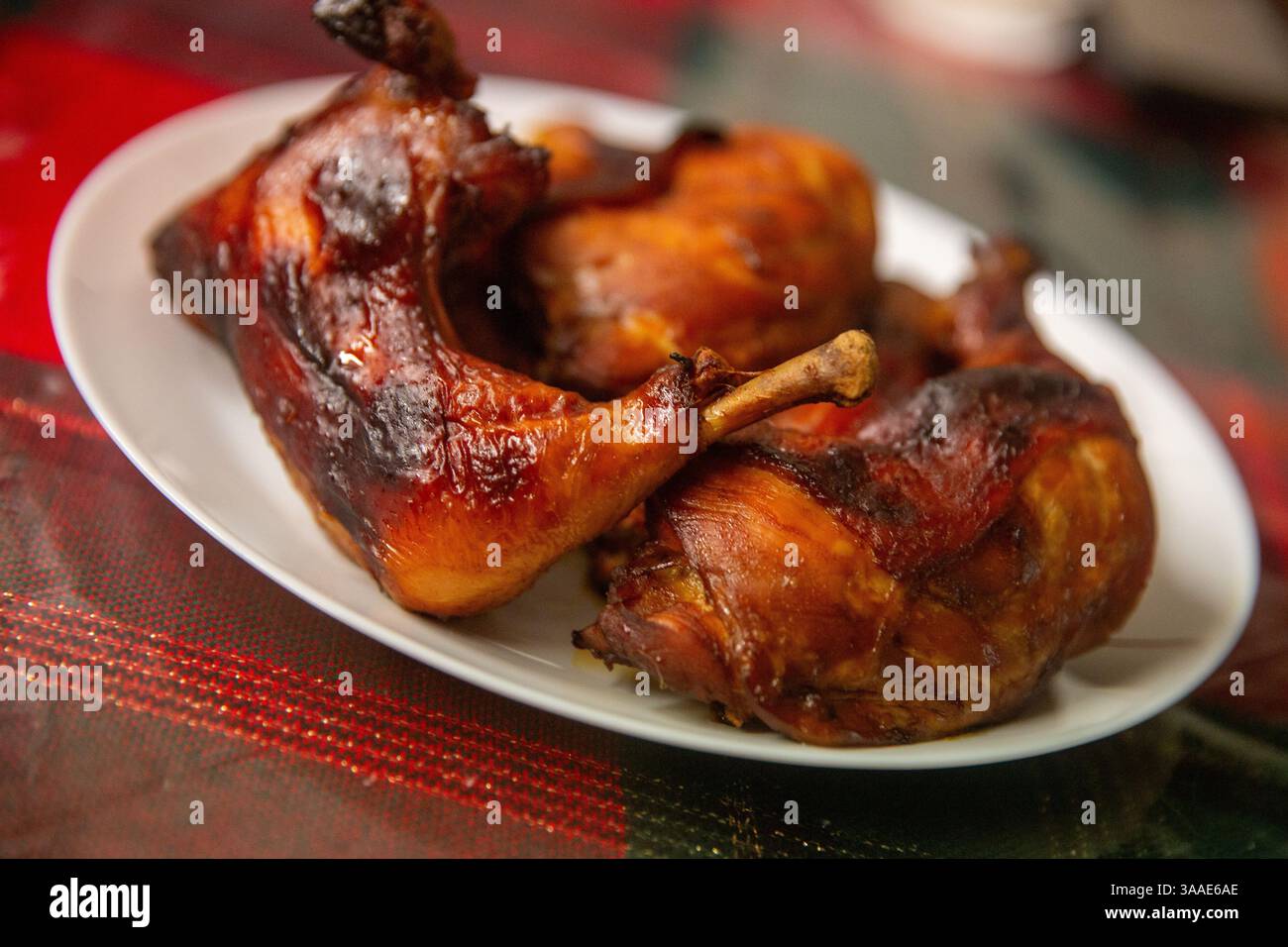 Roasted Marinated Chicken Quarters ready to grab Stock Photo - Alamy