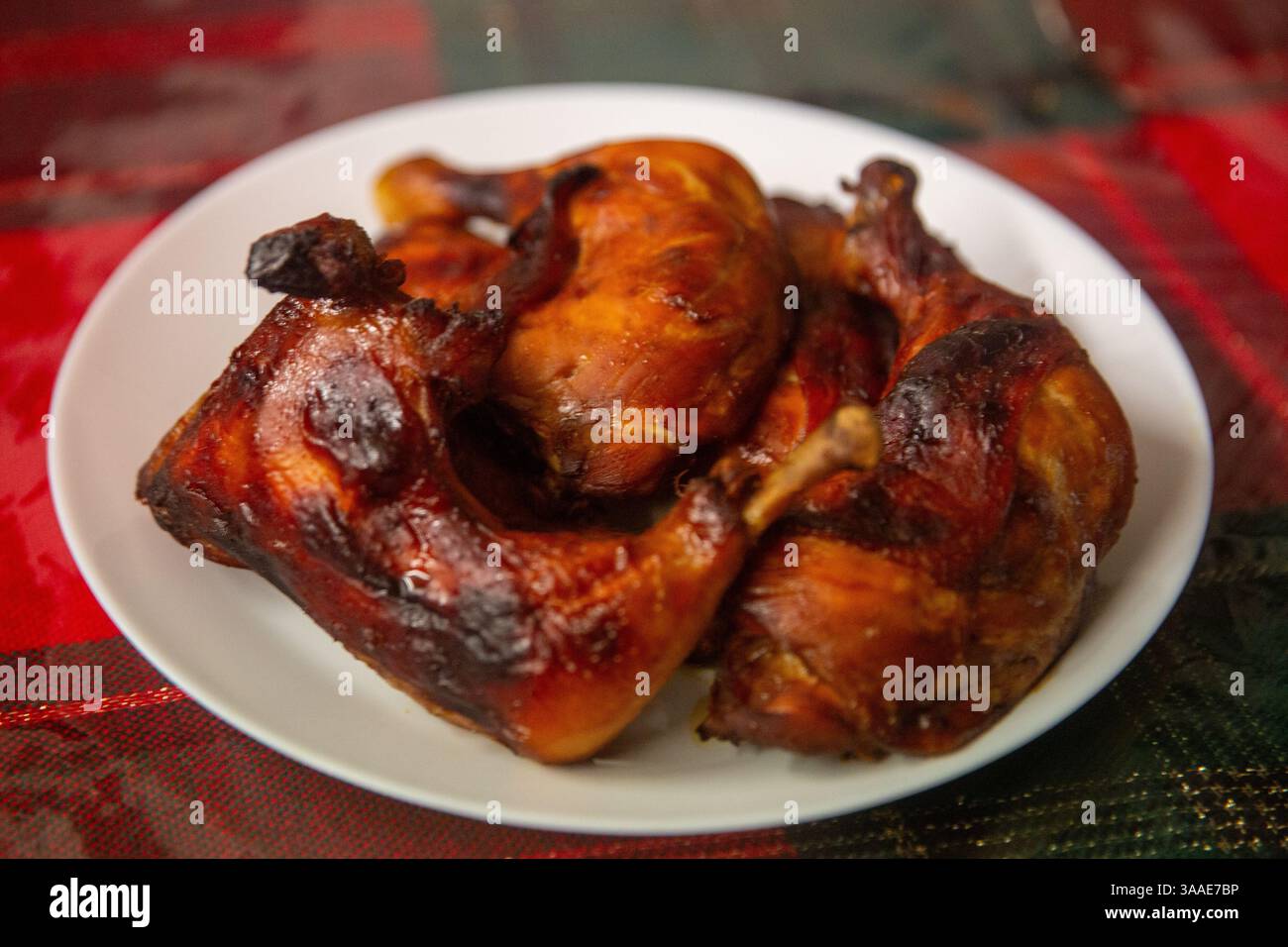 Roasted Marinated Chicken Quarters ready to grab Stock Photo - Alamy