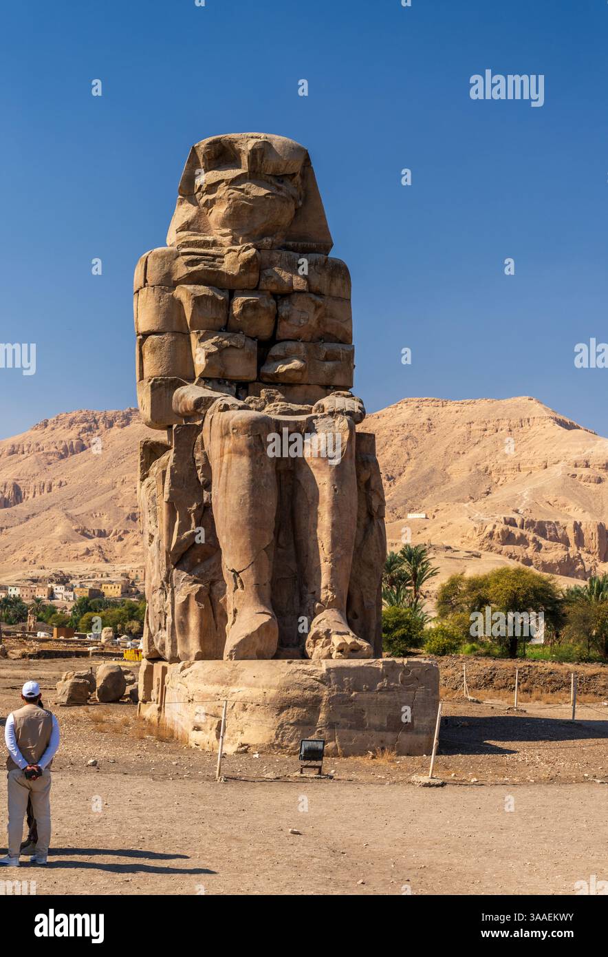 The Colossi of Memnon are two massive stone statues of the Pharaoh ...