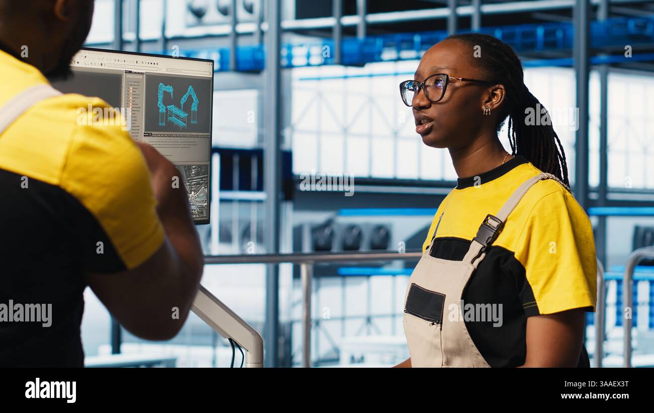 Engineering team in photovoltaics smart factory cooperating to diagnose damaged IoT sensors ...