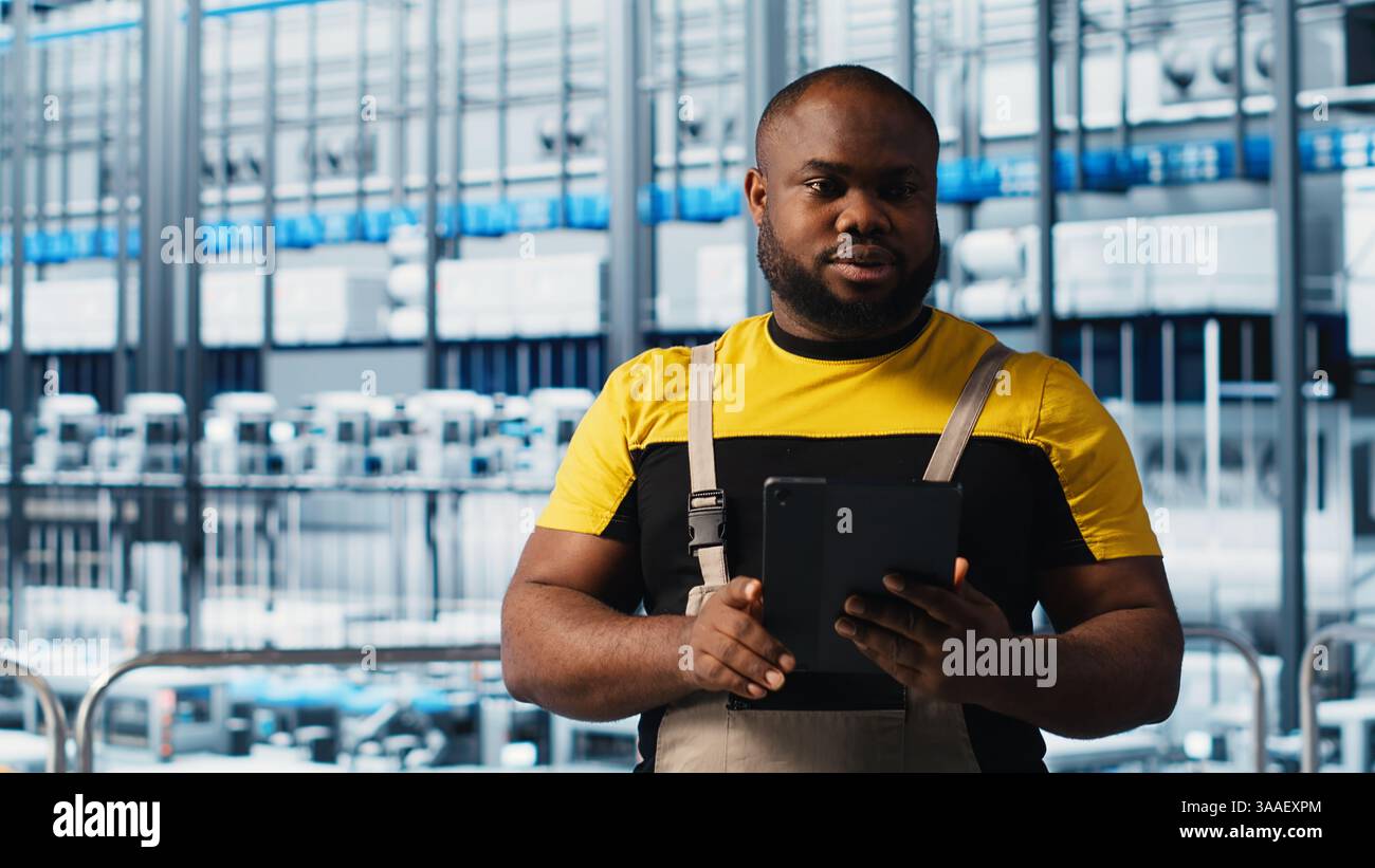 Industry 4.0 photovoltaics plant engineer overseeing using software on ...