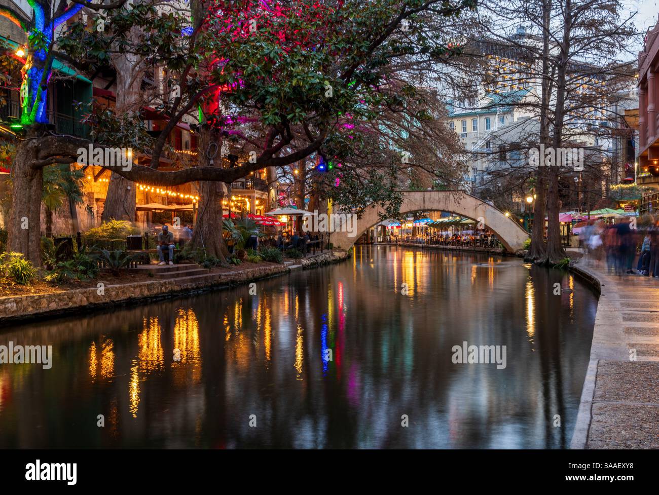 San Antonio, TX - 26 February 2025: Tourists dining along the riverwalk ...
