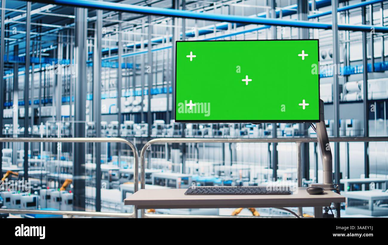 Tracking software displayed on green screen mockup monitor in industrial plant equipped with ...