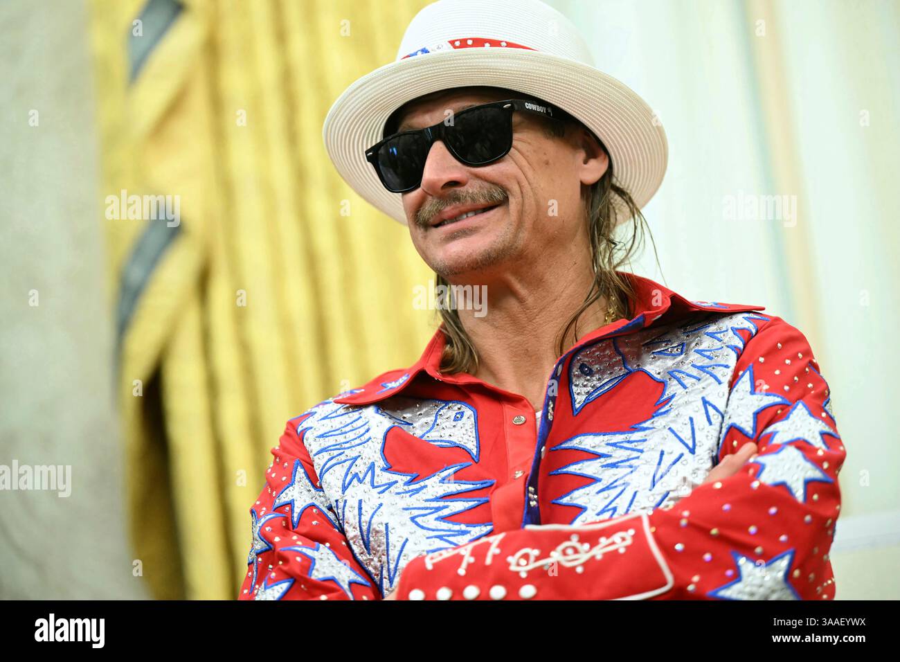 Kid Rock listens as President Donald Trump speaks to reporters before ...