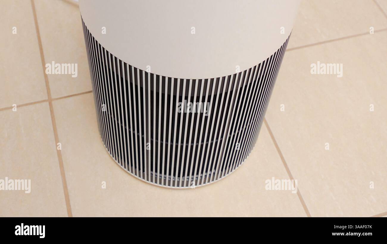 Sleek Modern Tall Air Purifier with Black Fan on Beige Tile Floor in ...