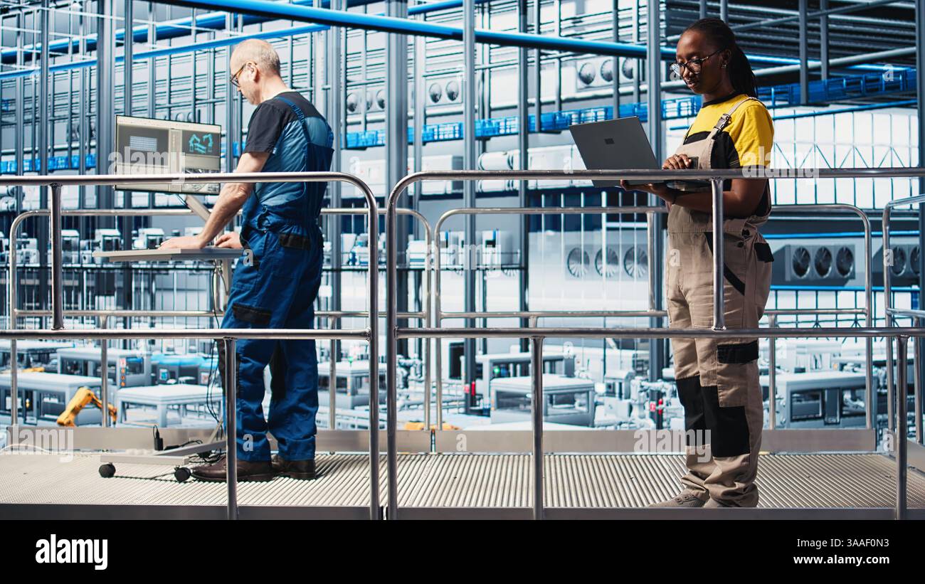 Smart photovoltaics factory engineering team looking at system performance metrics. Teamworking ...