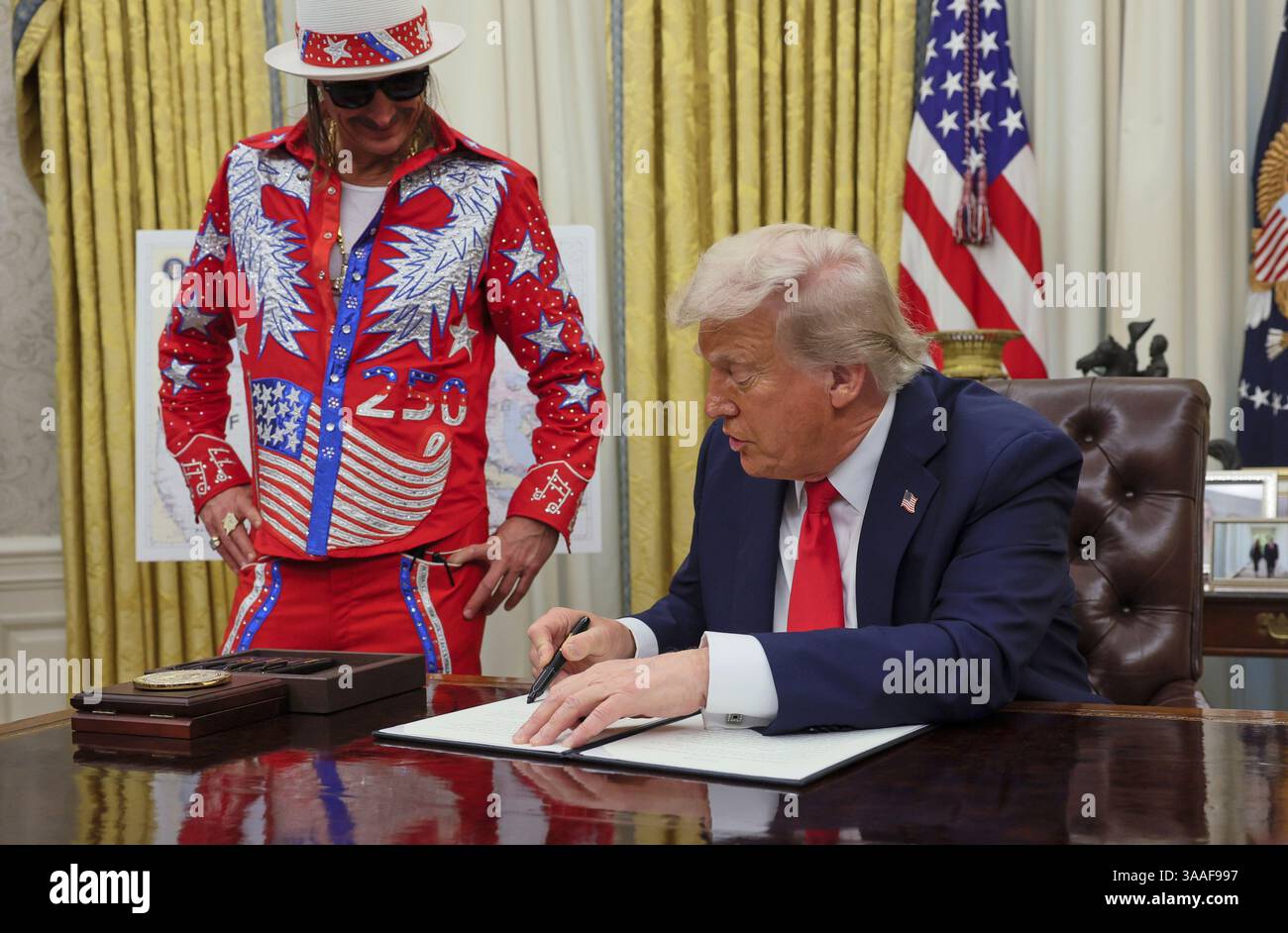 President Donald Trump signs an executive order again concert ticket ...