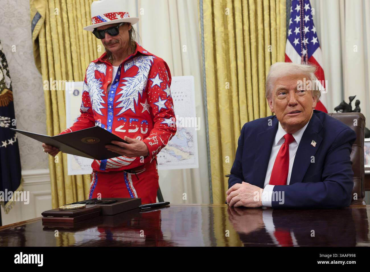 Kid Rock holds a signed executive order regarding entertainment ticket ...