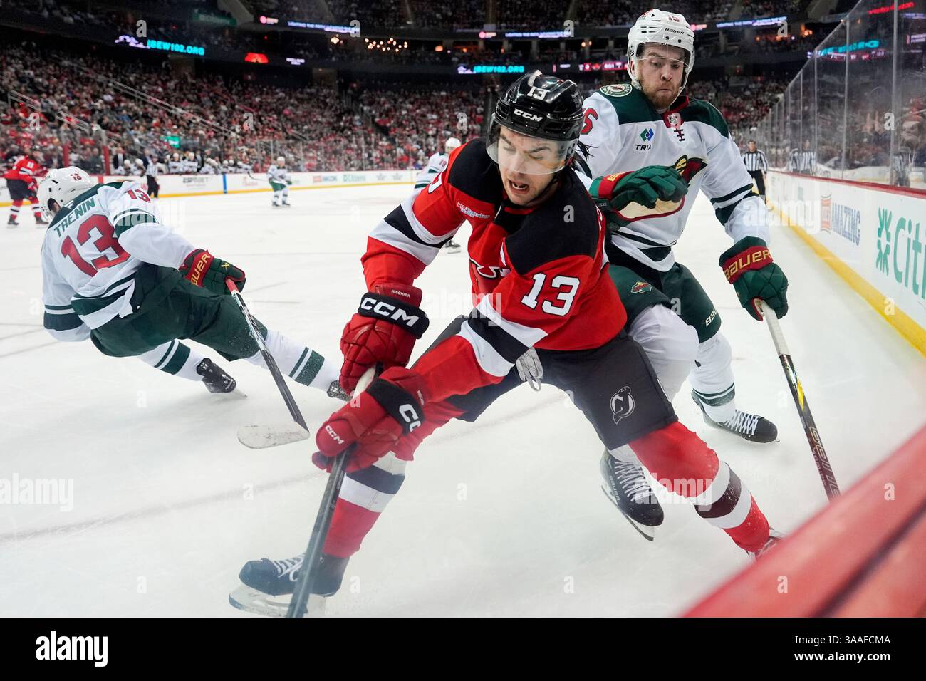 New Jersey Devils center Nico Hischier (13) and Minnesota Wild right ...