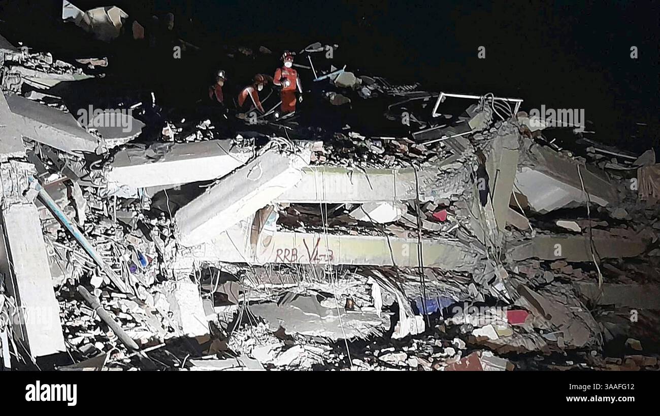 A photo shows an apartment building collapsed due to an earthquake in ...