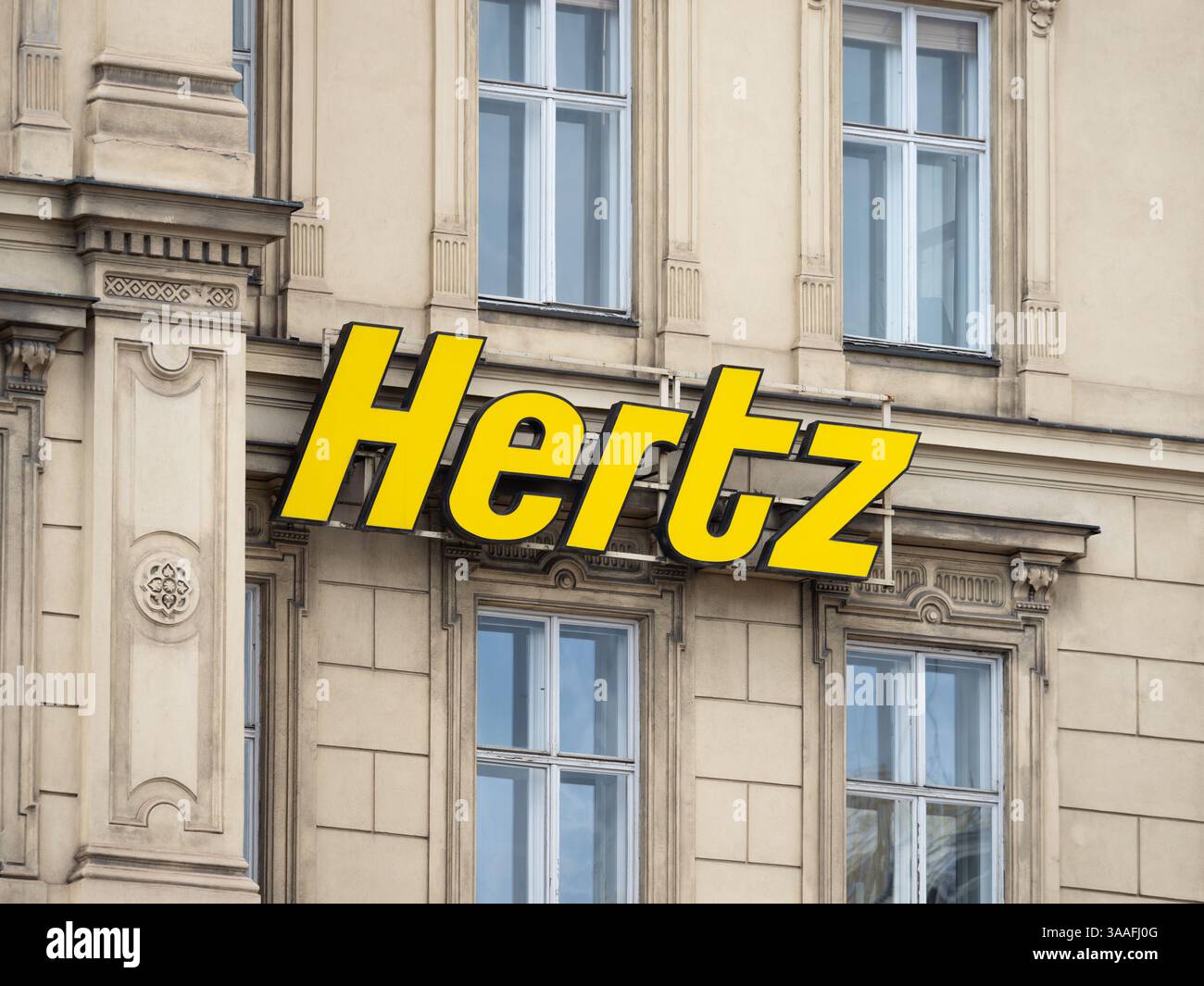 Hertz logo sign of the American car rental company. Business in the transportation and tourism ...