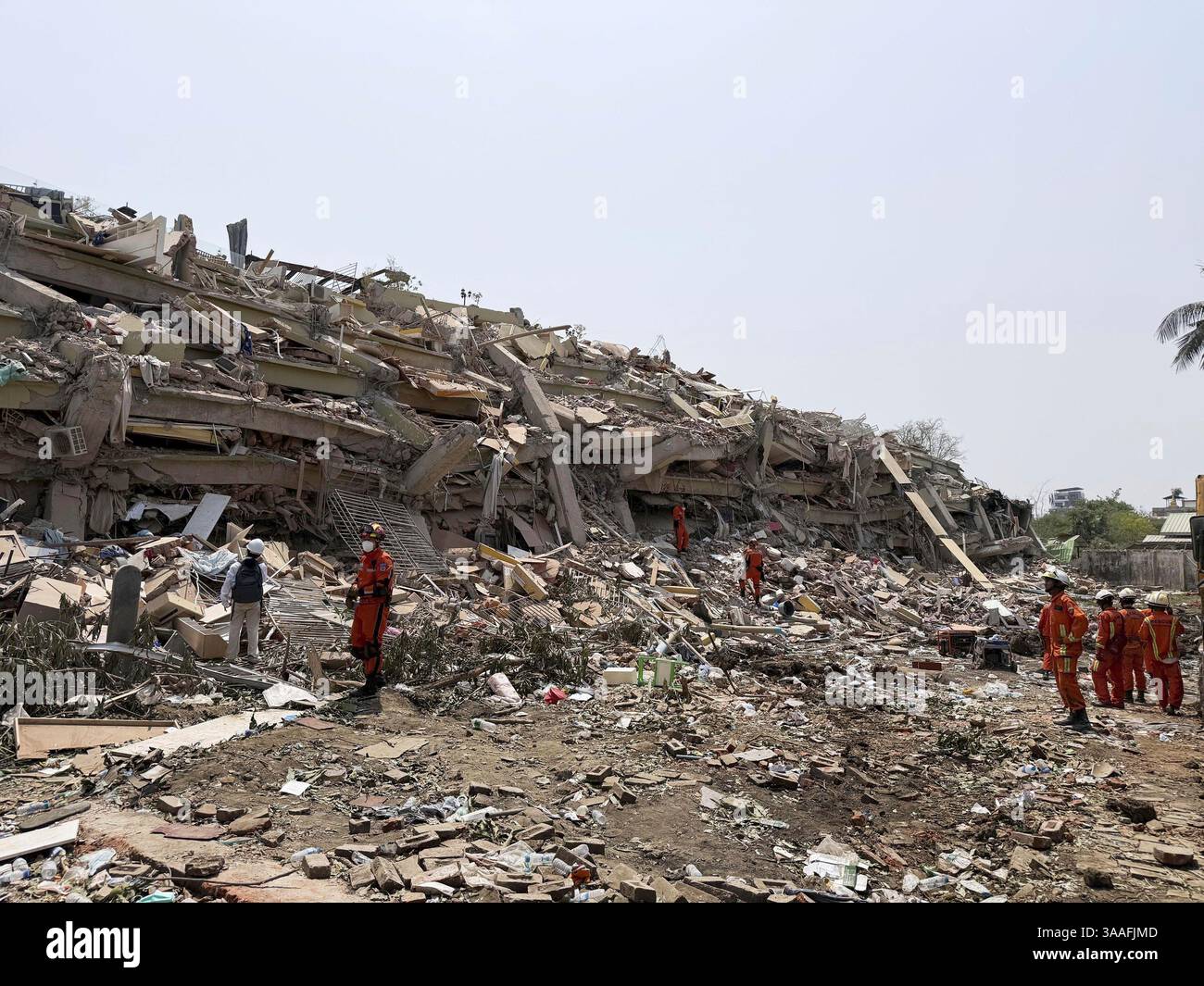 A rescue operation is continued in front of the collapsed Sky Villa ...