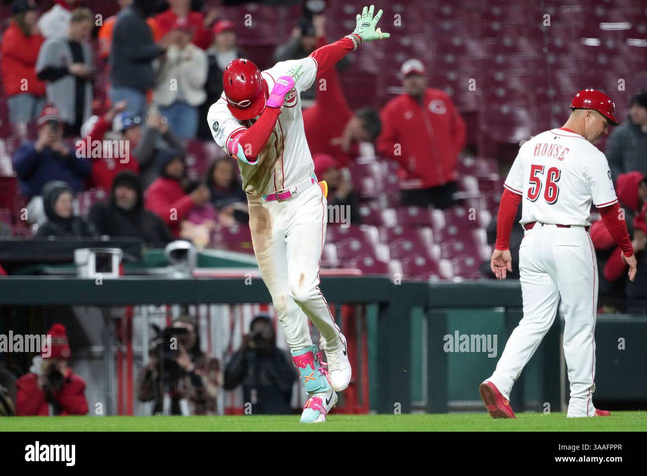 Cincinnati Reds' Elly De La Cruz, left, celebrates with third base ...