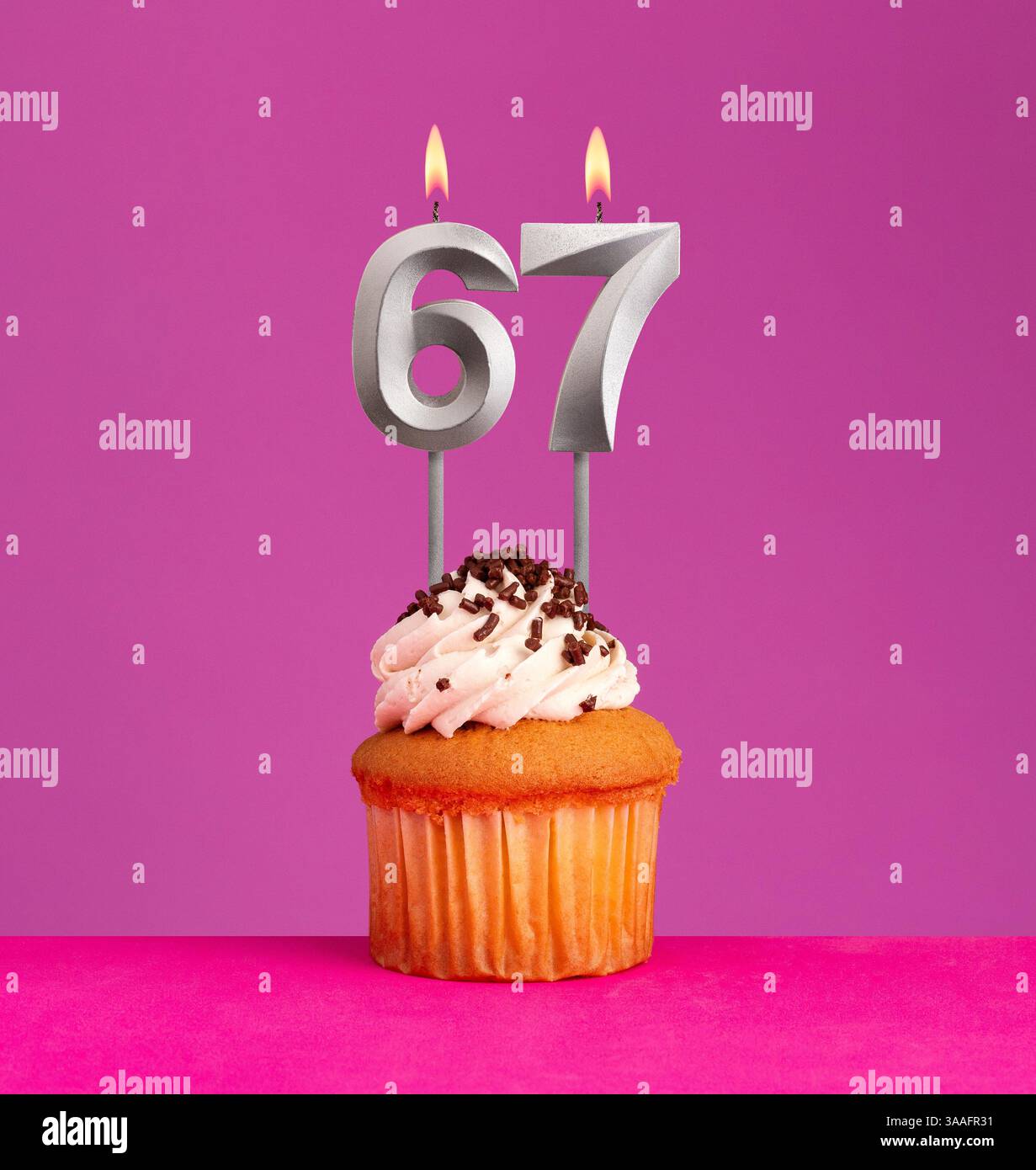 Birthday candle number 67 with cupcake on violet background Stock Photo ...