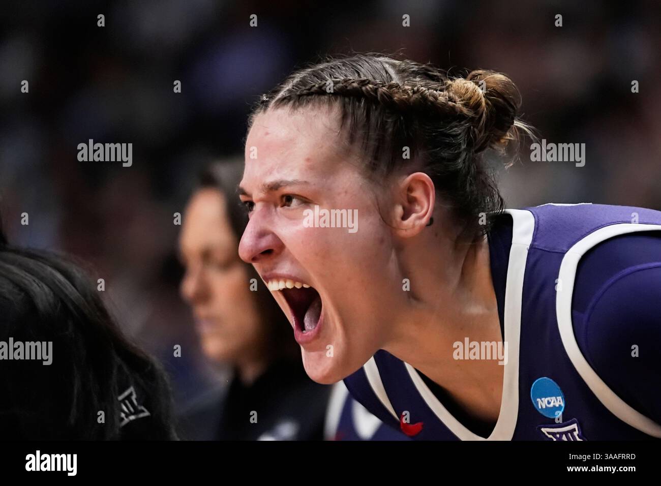 TCU center Sedona Prince calls out from the bench after fouling out ...