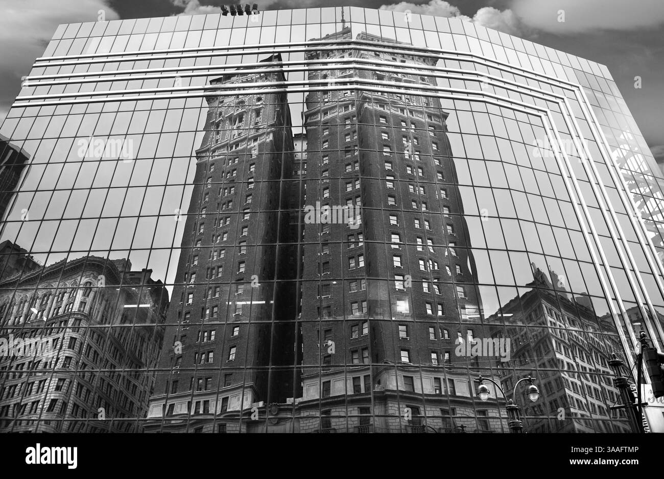 Historic skyscraper reflected in the opposite glass facade of a high ...