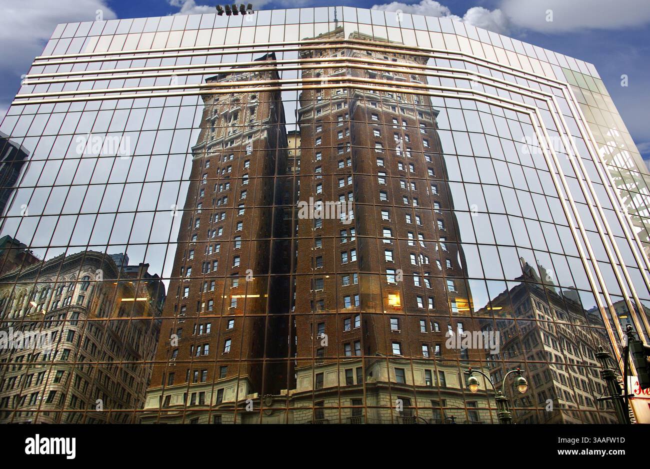 Historic skyscraper reflected in the opposite glass facade of a high ...