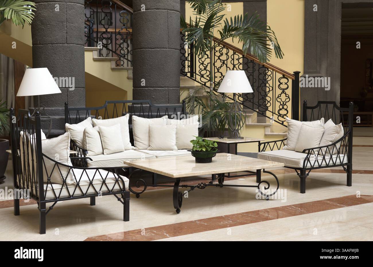 The lobby of the hotel with black columns Stock Photo - Alamy