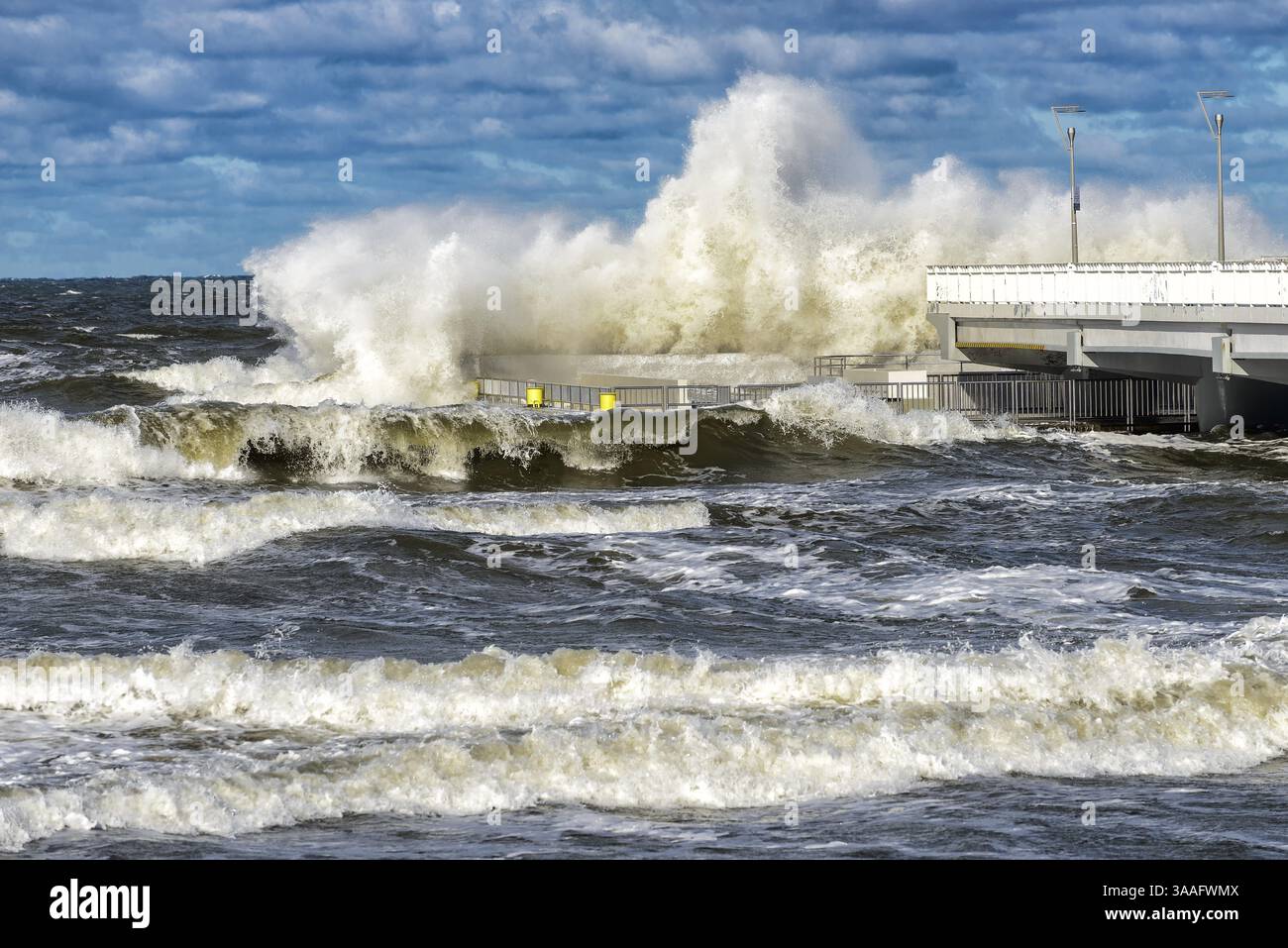 Waves crashing on breakwaters baltic hi-res stock photography and ...