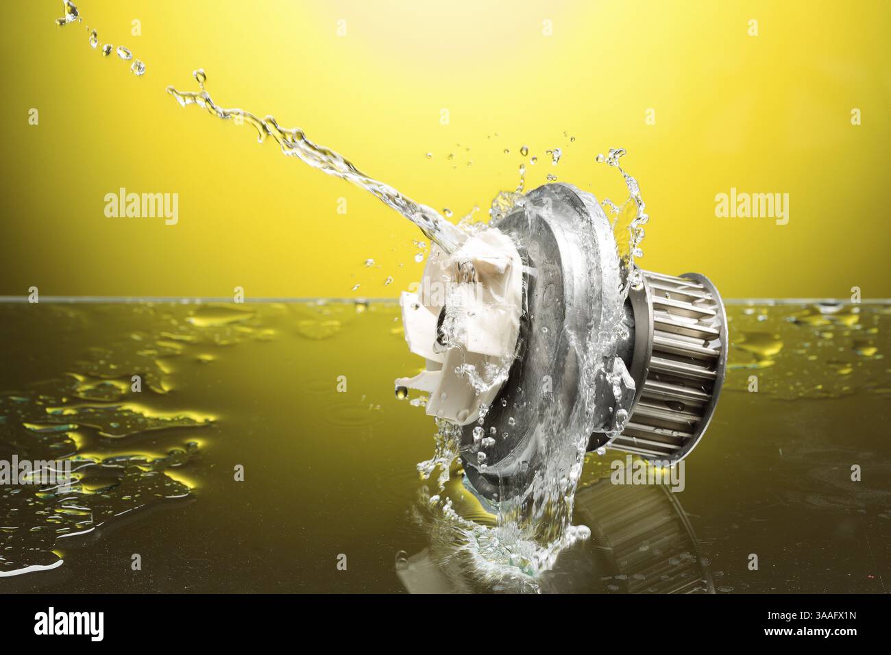 Auto parts, engine cooling pump in water splash on yellow gradient ...