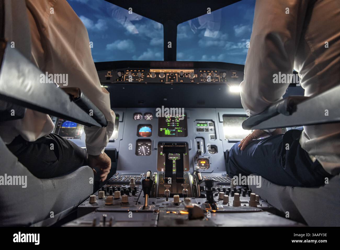 Pilots in the cockpit of an aircraft during a flight Stock Photo - Alamy