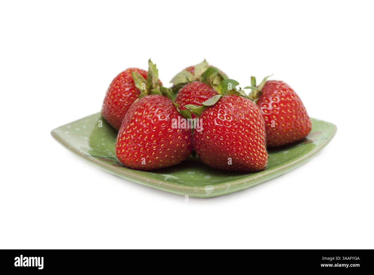 Strawberries on green chinese saucer on white background Stock Photo ...