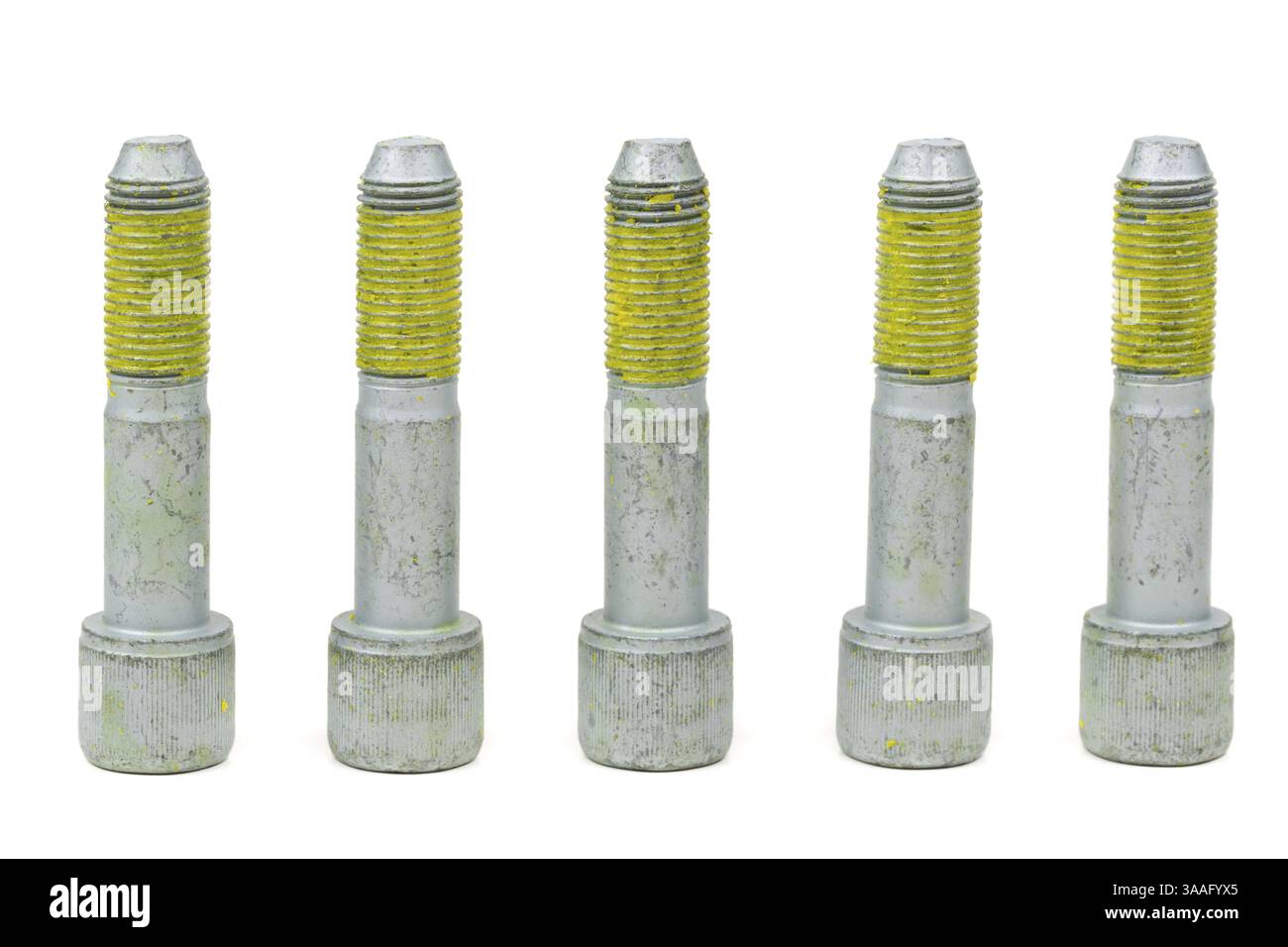 Five bolts for the car with the yellow glue on the threads. Isolate on ...