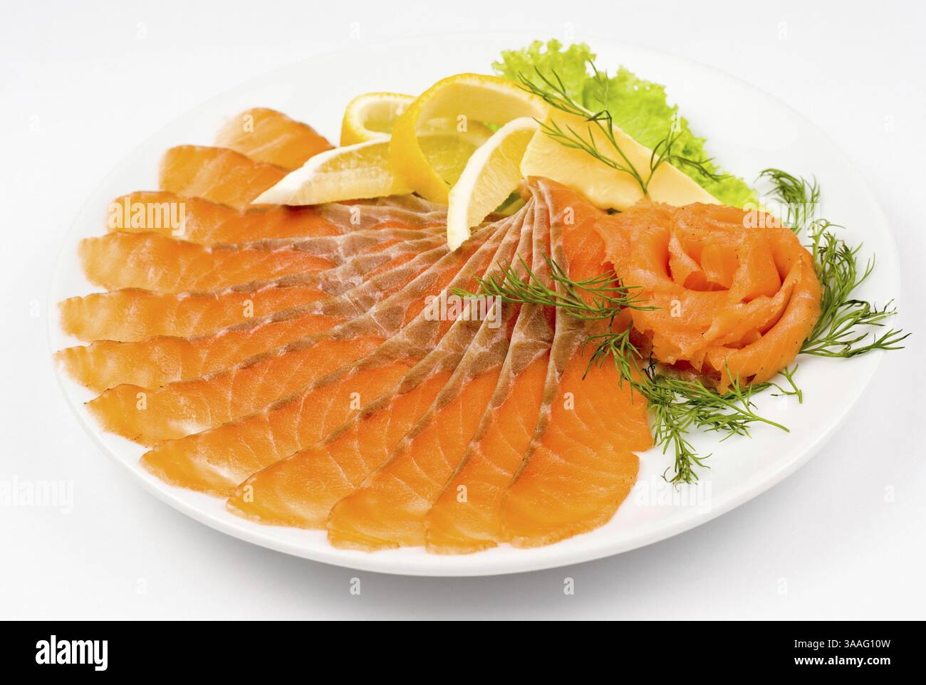 Sliced smoked salmon served with lemon and salmon rose Stock Photo - Alamy