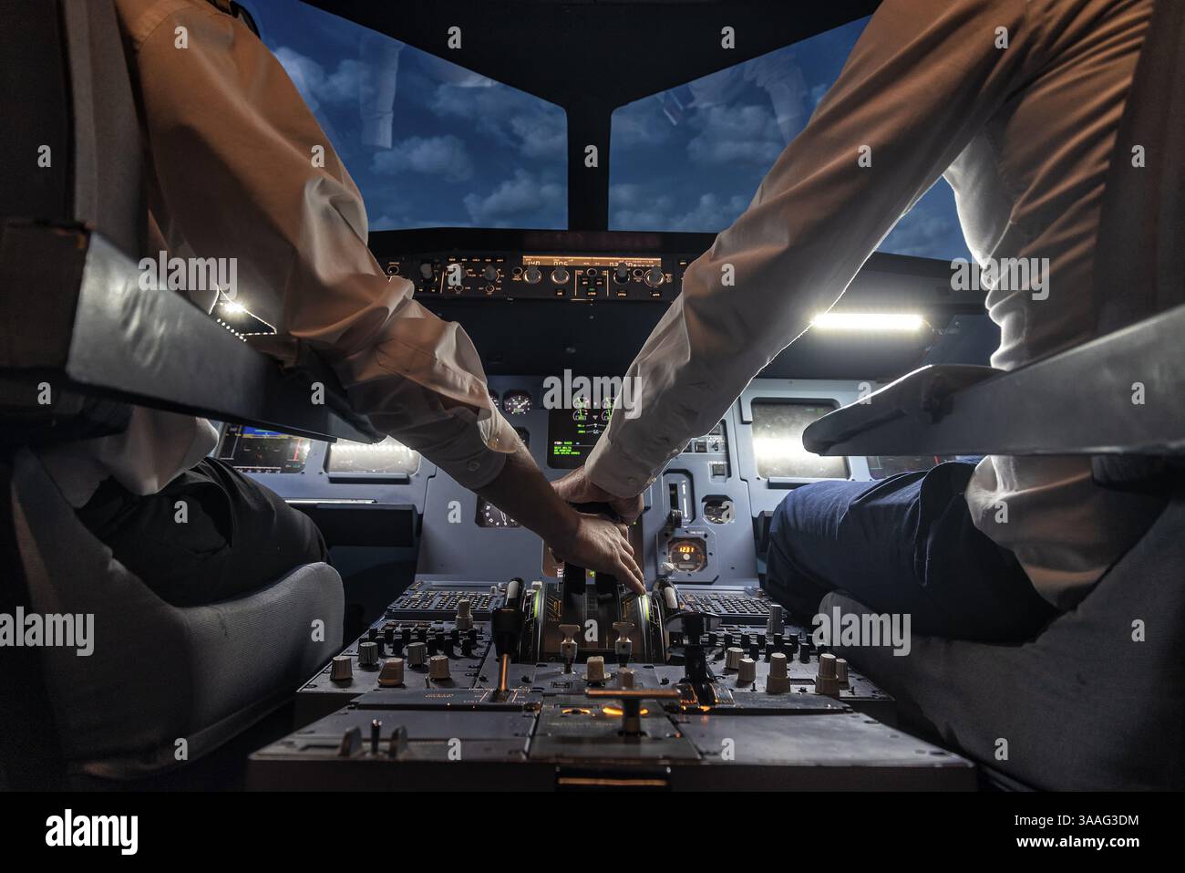 Pilots in the cockpit of an aircraft during a flight Stock Photo - Alamy