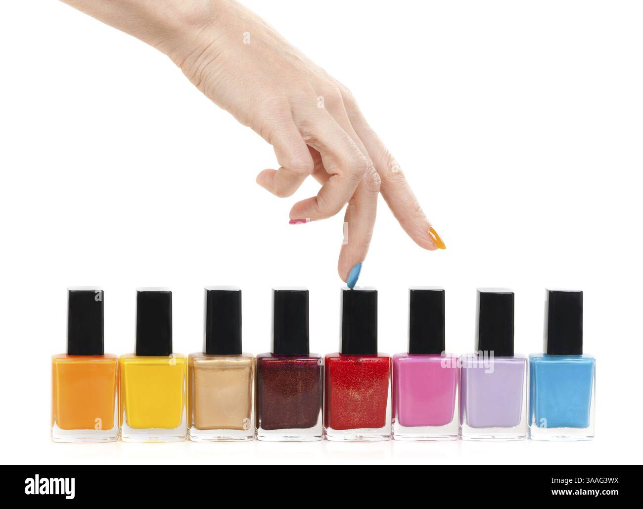 Female hand fingers are the colored paints polish isolate on a white ...