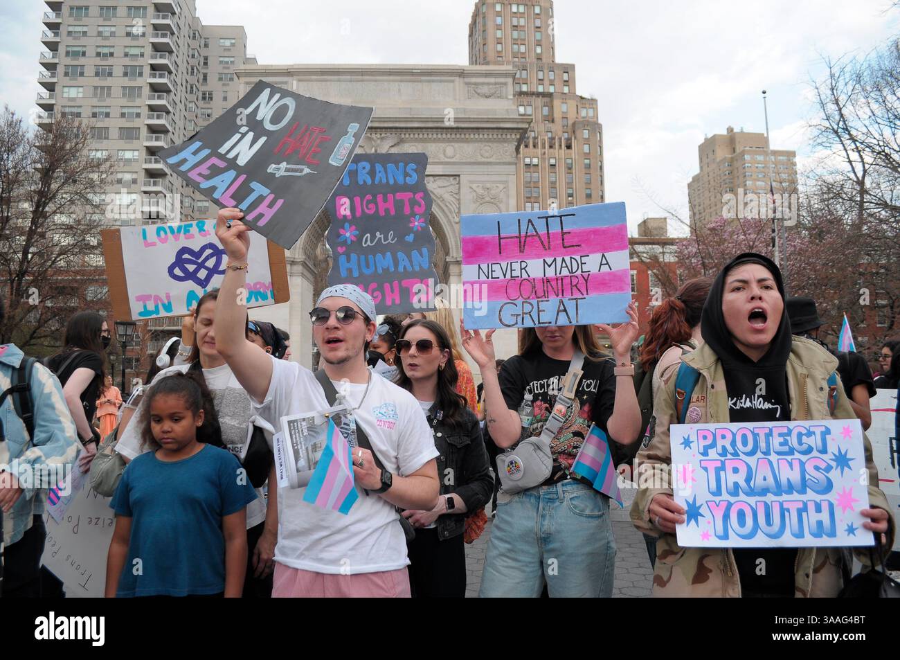 New York, United States. 31st Mar, 2025. Demonstrators hold placards ...