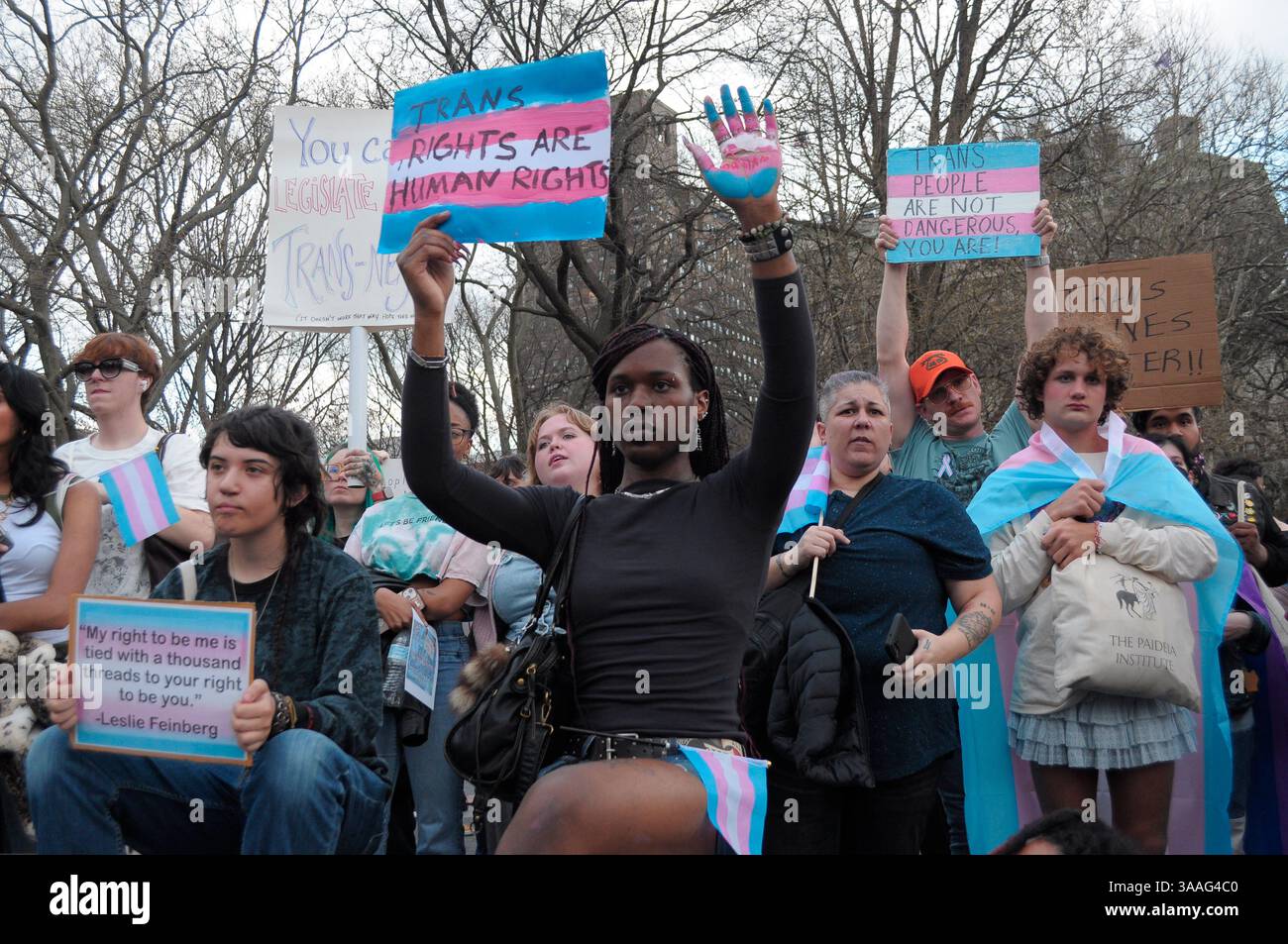 New York, United States. 31st Mar, 2025. Demonstrators hold placards ...
