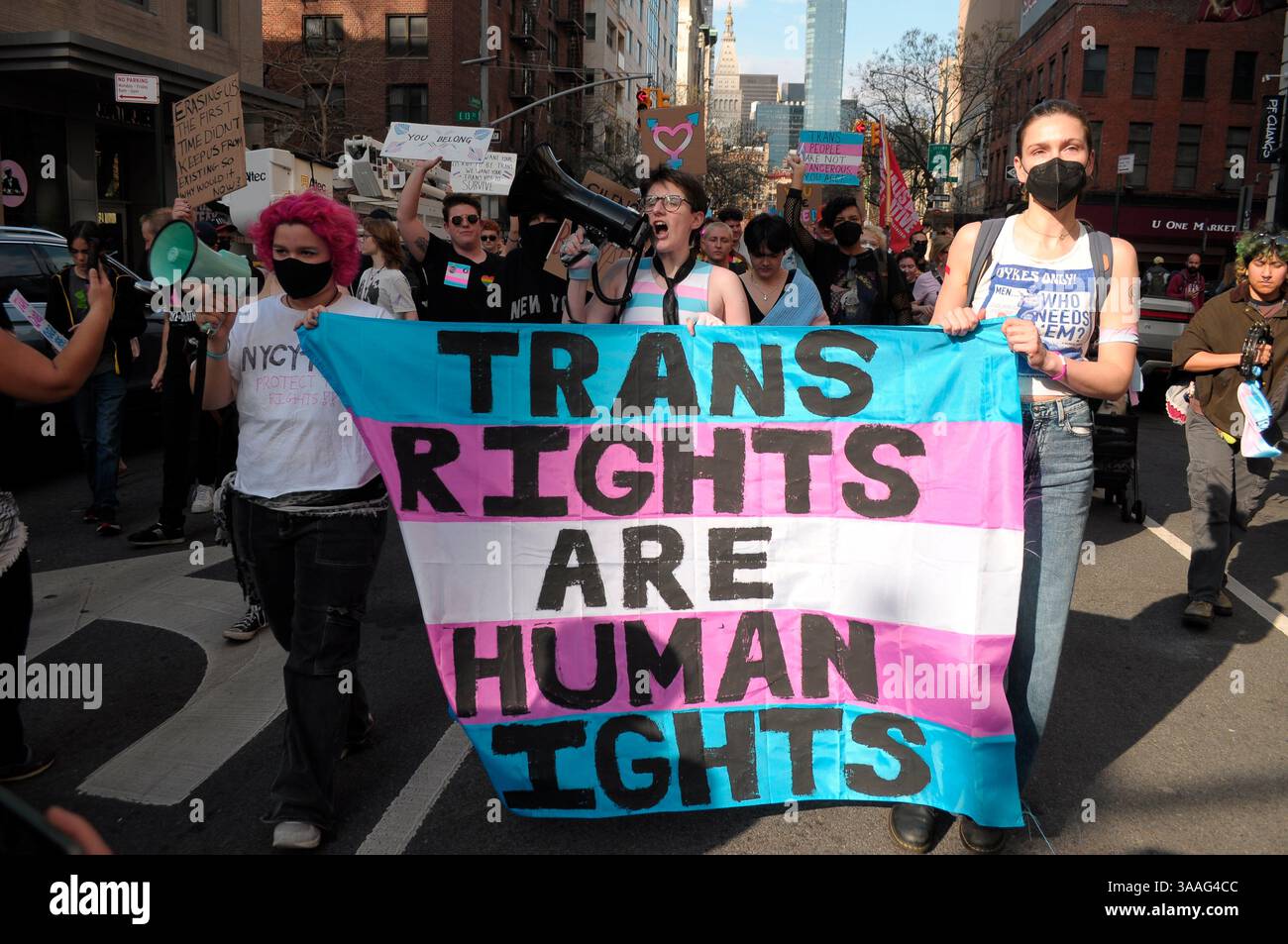 New York, United States. 31st Mar, 2025. Demonstrators hold a banner at ...